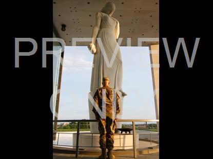 Soldier At Attention In Front Of Memory Statue | Sparrow Stock ...